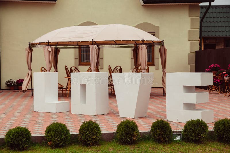 White Large Letters LOVE Stand on the Backyard Stock Photo - Image of ...