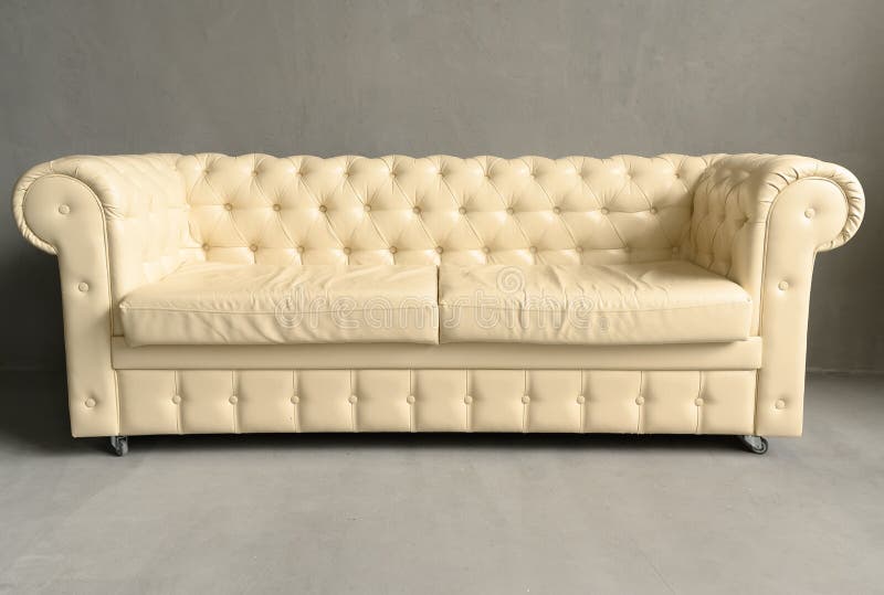 White Leather Sofa in a Dark Studio. Modern Comfortable Cozy Stock ...