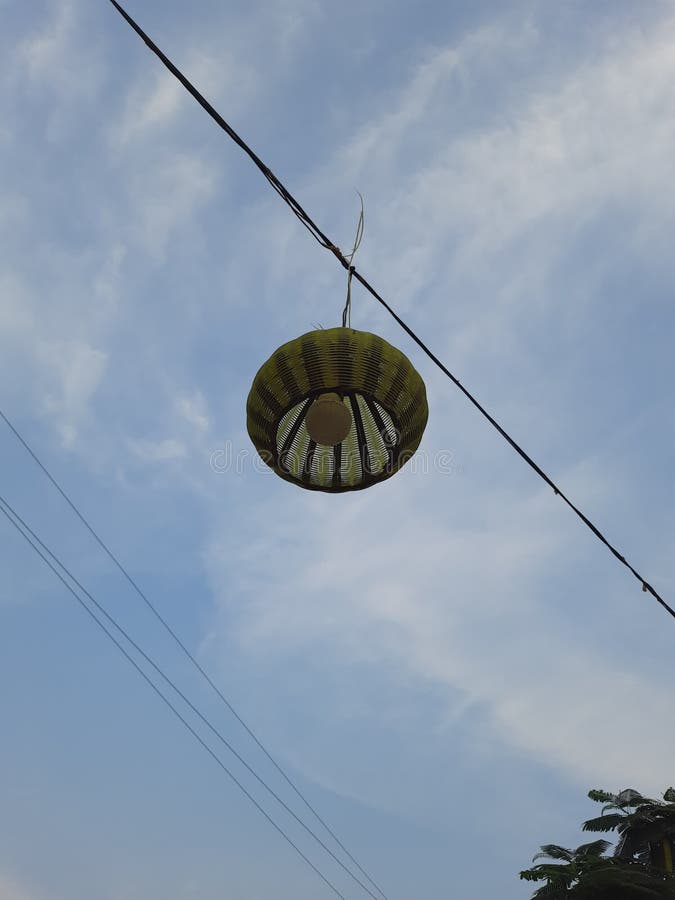 White LED Bulb in a Basket Hanged To a Wire Stock Photo - Image of ...
