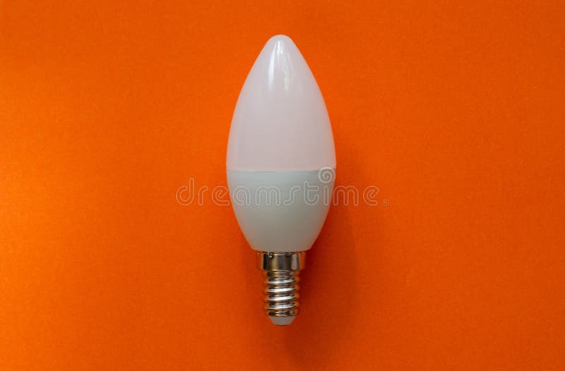 White LED Light Bulb on a Orange Background Stock Image - Image of ...