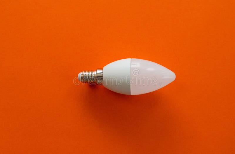 White LED Light Bulb on a Orange Background Stock Image - Image of ...