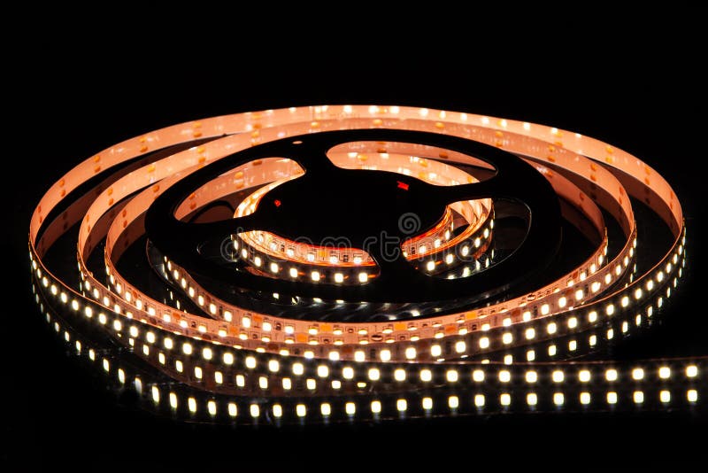 Reel of Black Hose Pipe and Spraying Head on the Red Texture Brick Wall ...