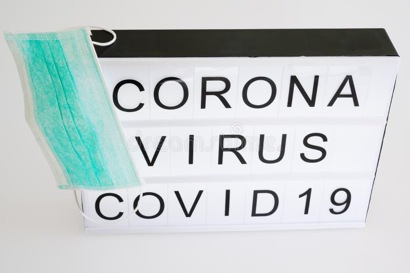 White Light Box with Text Coronavirus with One Blue Protective Mask ...
