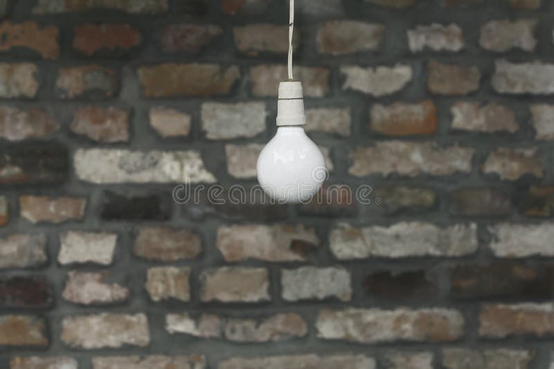 White Light Bulb in Front of Brick Texture Wall Stock Photo - Image of ...