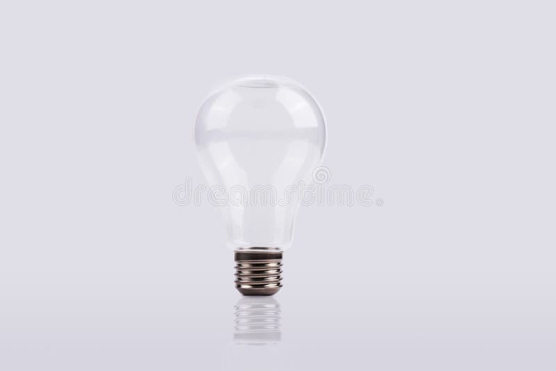 A White Light Bulb in Front of a Grey Background Stock Photo - Image of ...