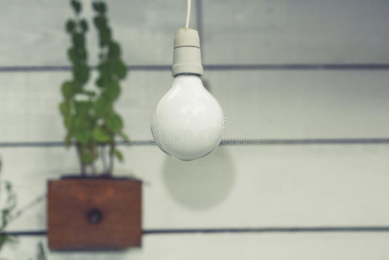 White Light Bulb in Front of Home Decor Wooden Texture Stock Image ...