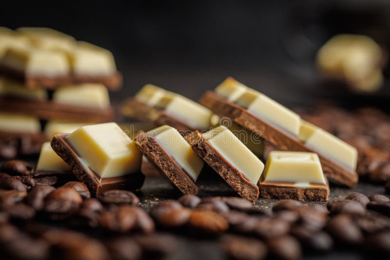 White Light Dark Chocolate Bars and Coffee Beans on Black Table Stock ...