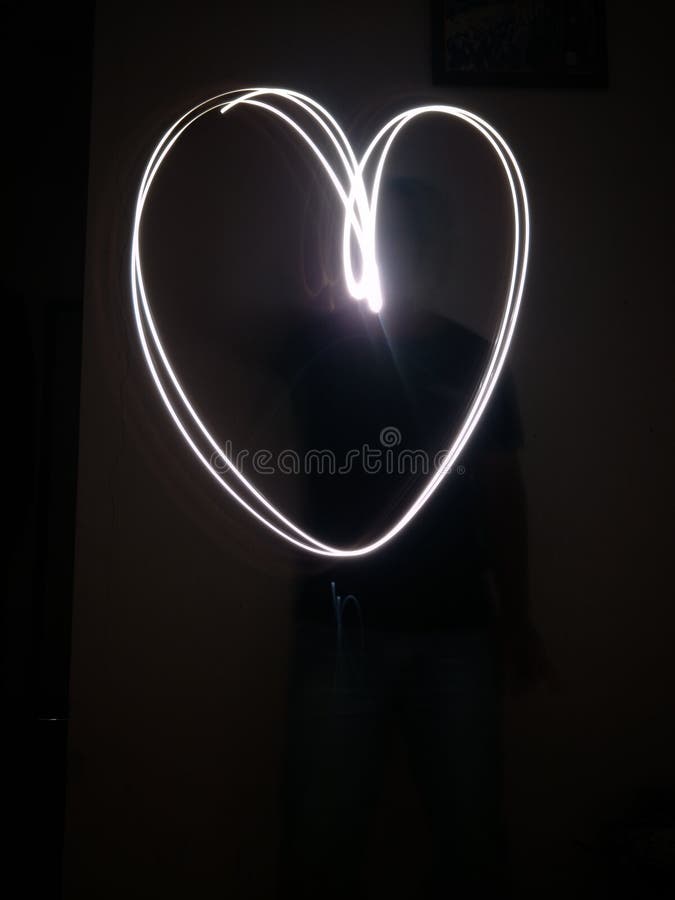 White Light from a Flashlight Draws a Heart at Night. Stock Photo ...