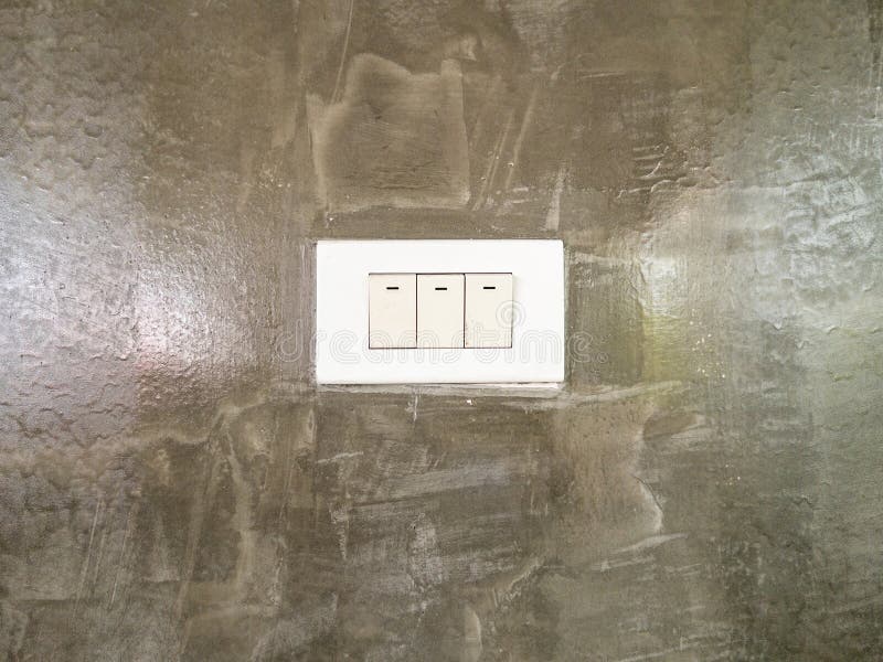 The White Light Switch on the Loft Polished Bare Cement Wall Stock ...