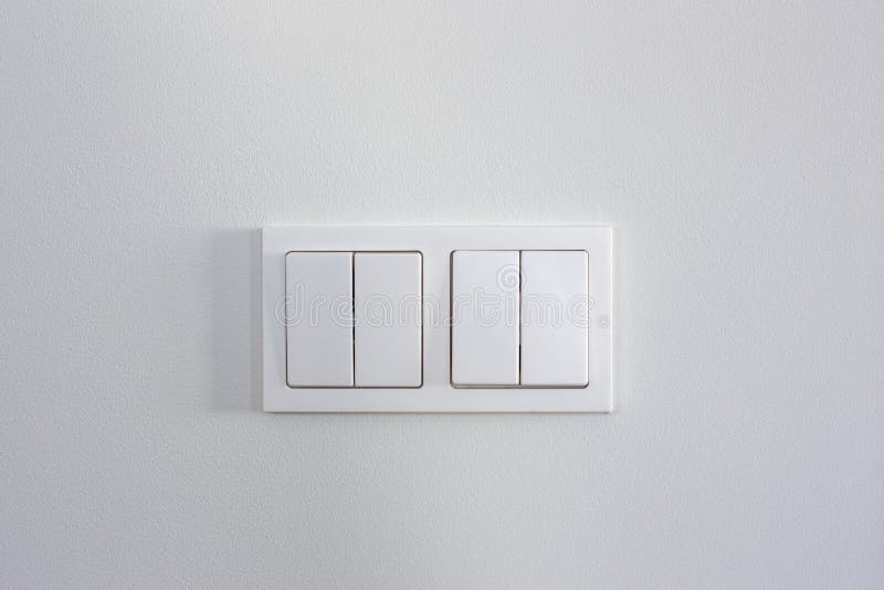 White Light Switches on a White Wall Stock Image - Image of outlet ...