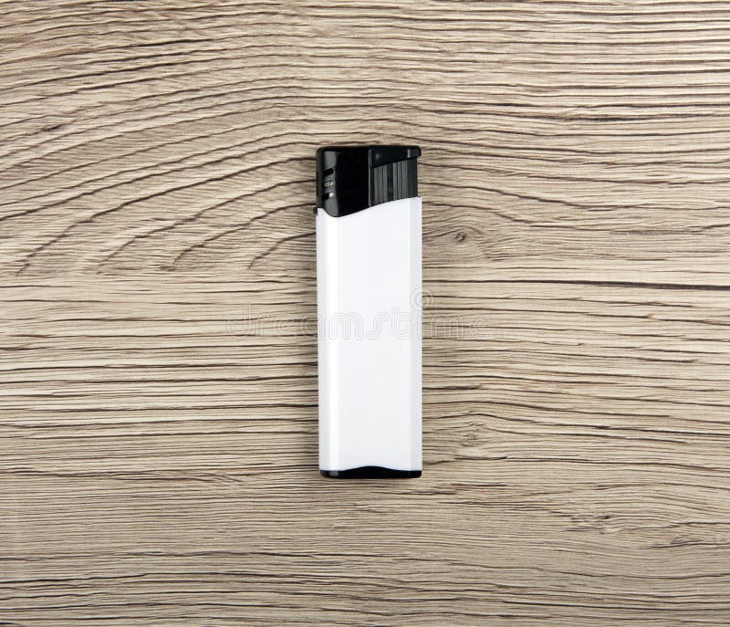 White Lighter on a Wooden Background. Stock Image - Image of black ...