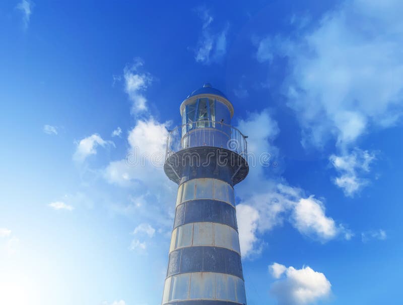 White Lighthouse Against Blue Sky in Soft Sunlight Stock Photo - Image ...