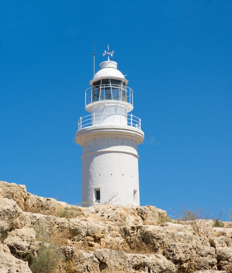 White Lighthouse Against a Blue Sky Stock Image - Image of mountains ...