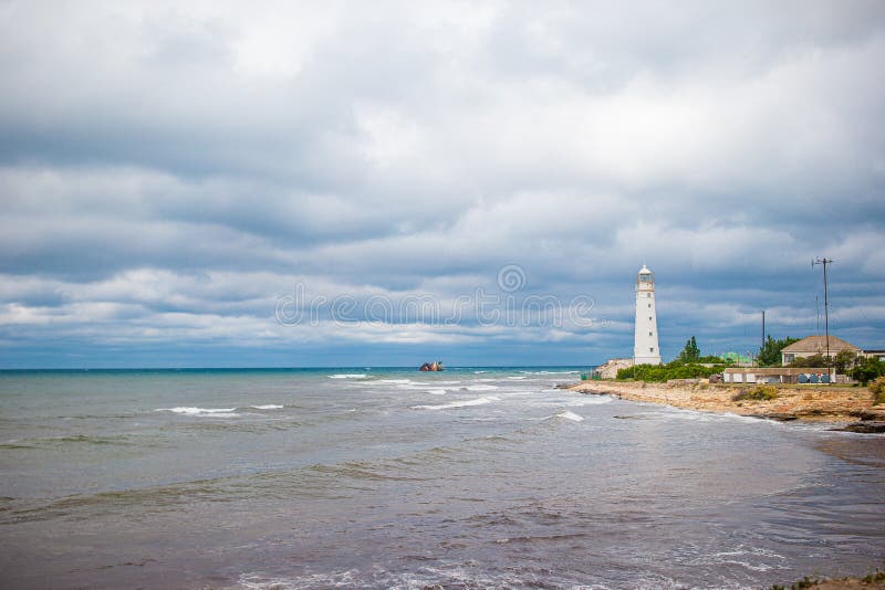 White Lighthouse in a Bay at Sea Stock Photo - Image of ideas ...
