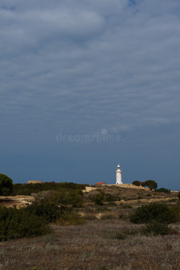 White Lighthouse Far Away in Cloudy Weather Stock Image - Image of wall ...