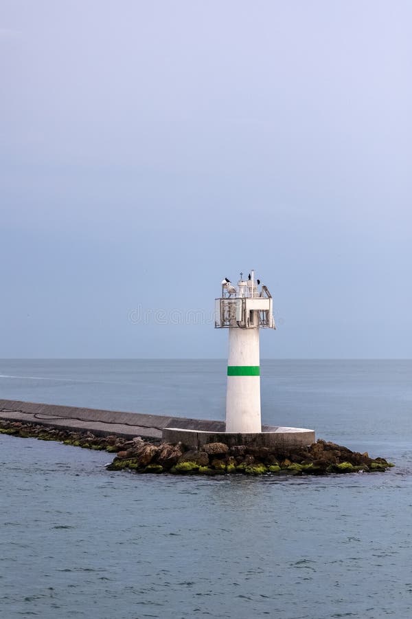 White Lighthouse on the Isalnd in the Ocean Stock Image - Image of ...