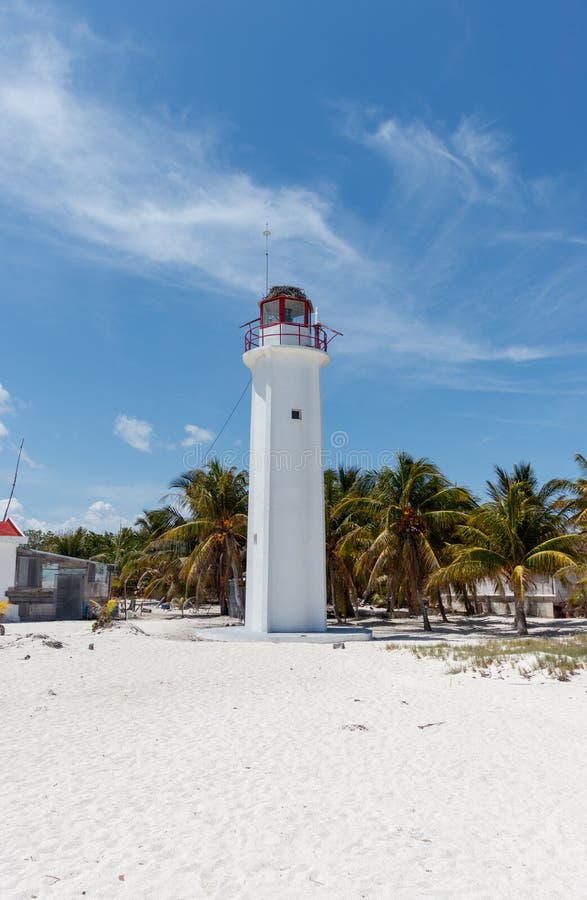 White Lightouse with Lush Palm Trees at Remote Beach Cabo Catoche in ...