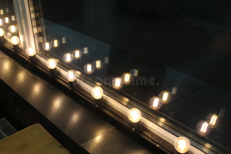 White Lights Out of Focus with a Reflection in the Glass. Neon Lights ...