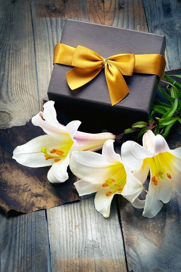 White Lily with Box on Wooden Table Stock Image - Image of lilies ...