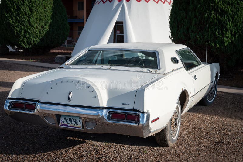 White Lincoln Continental Mark IV Vehicle Parked in Front of a Store ...