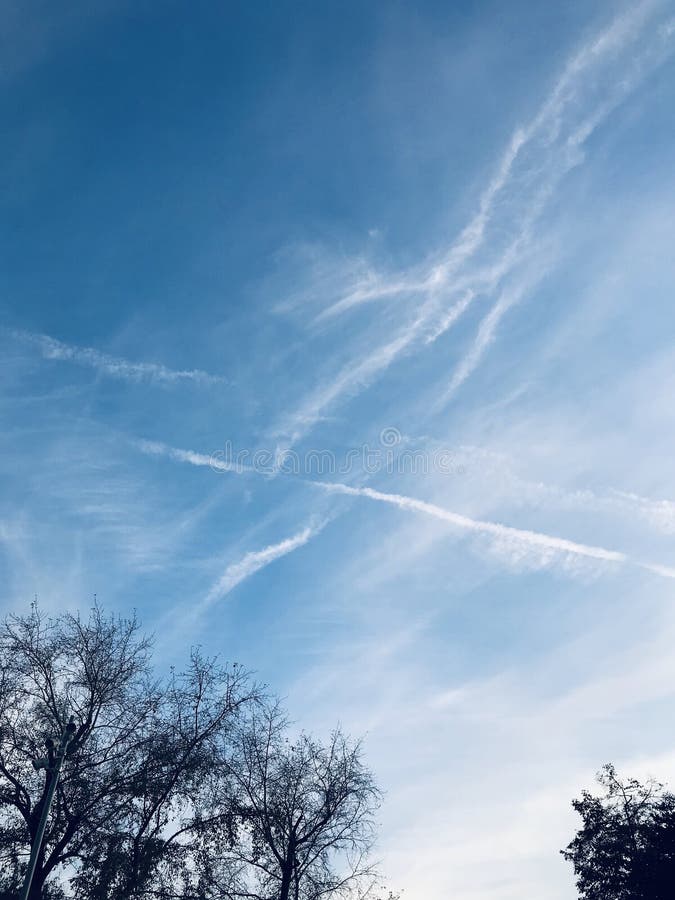 Lines of Flight of Aircraft in the Sky Stock Photo - Image of shape ...