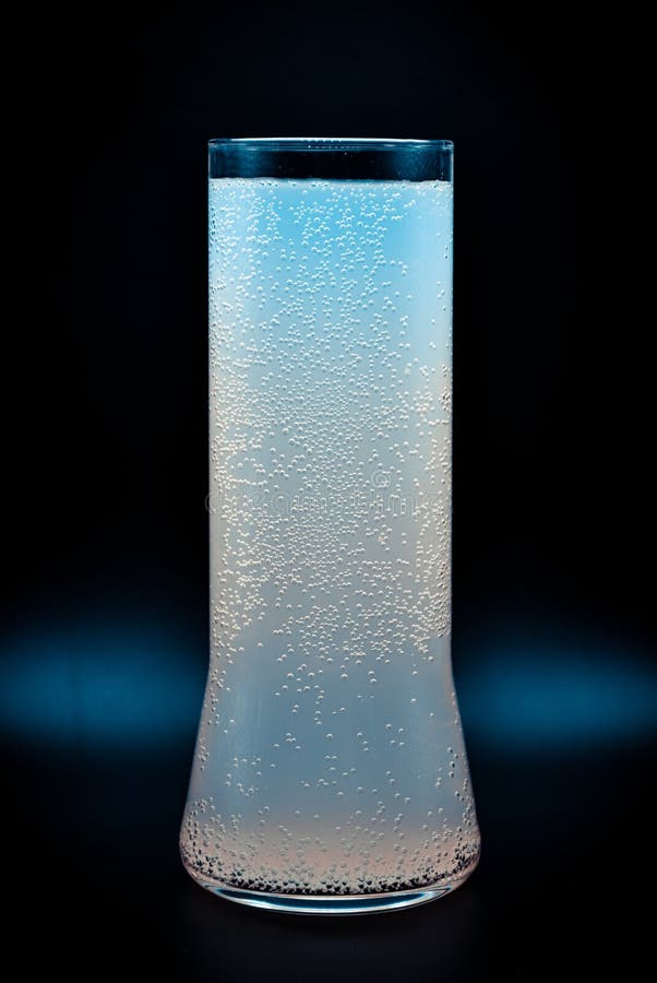 Glass Flask on Black Background with Yellow Liquid and White Foam Stock ...