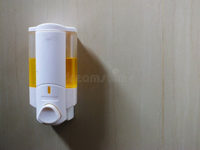 The White Liquid Soap Container with Yellow Liquid Inside Stock Image ...