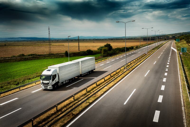 White Lorry on a Highway at a Cloudy Day Stock Photo - Image of freight ...