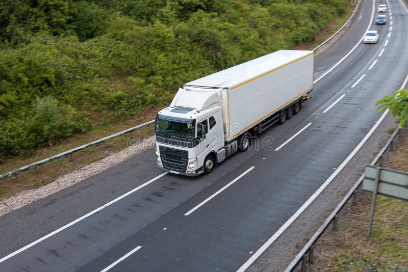 White Lorry Travelling on Motorway Stock Photo - Image of front, moving ...