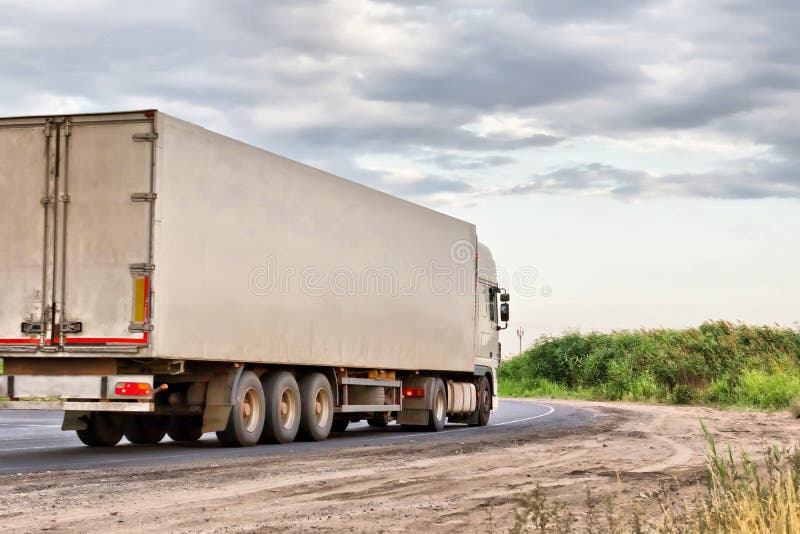 White Lorry with White Trailer Over Blue Sky on the Road Stock Photo ...
