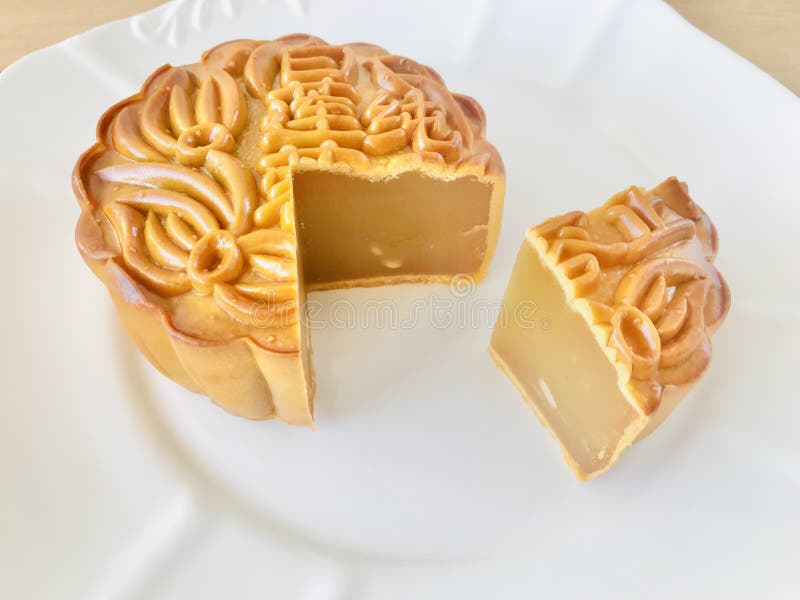 White Lotus Seed Paste Baked Mooncake with a Portion Cutout. Stock ...
