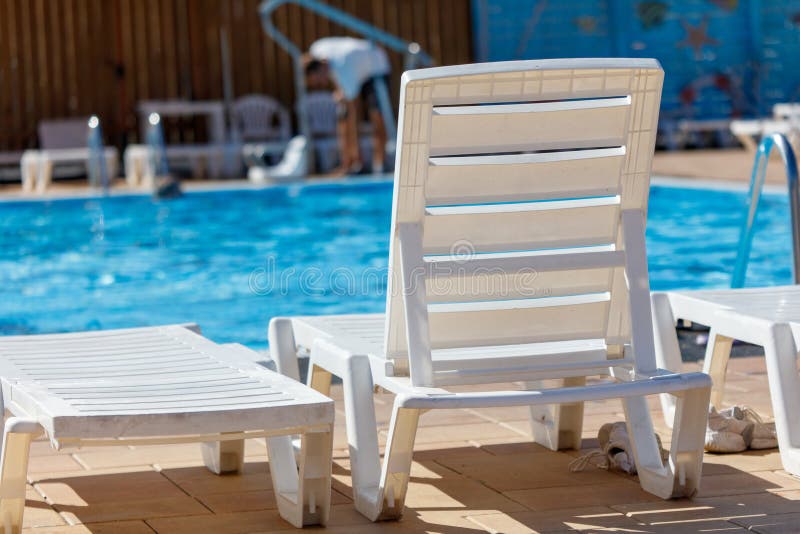 White Lounge Chair Sitting Front Pool Stock Photos - Free & Royalty ...