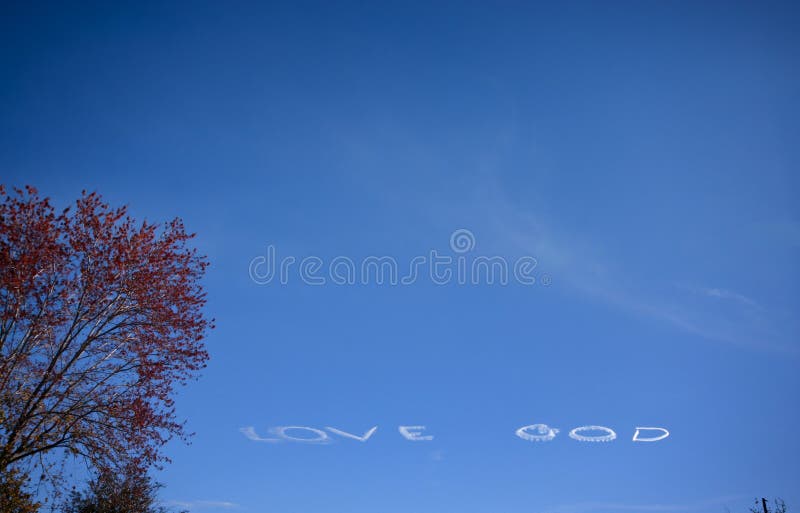 White LOVE GOD Text Created at Blue Sky Stock Image - Image of concept ...