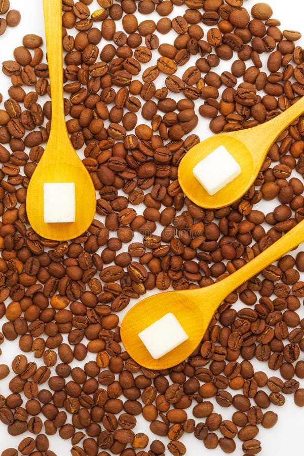White Lump Sugar on Wooden Spoons and Coffee Beans Stock Image - Image ...