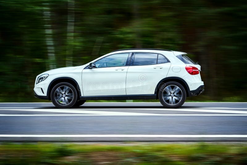White Luxury Suv Car Goes Fast through the Forest Stock Photo - Image ...