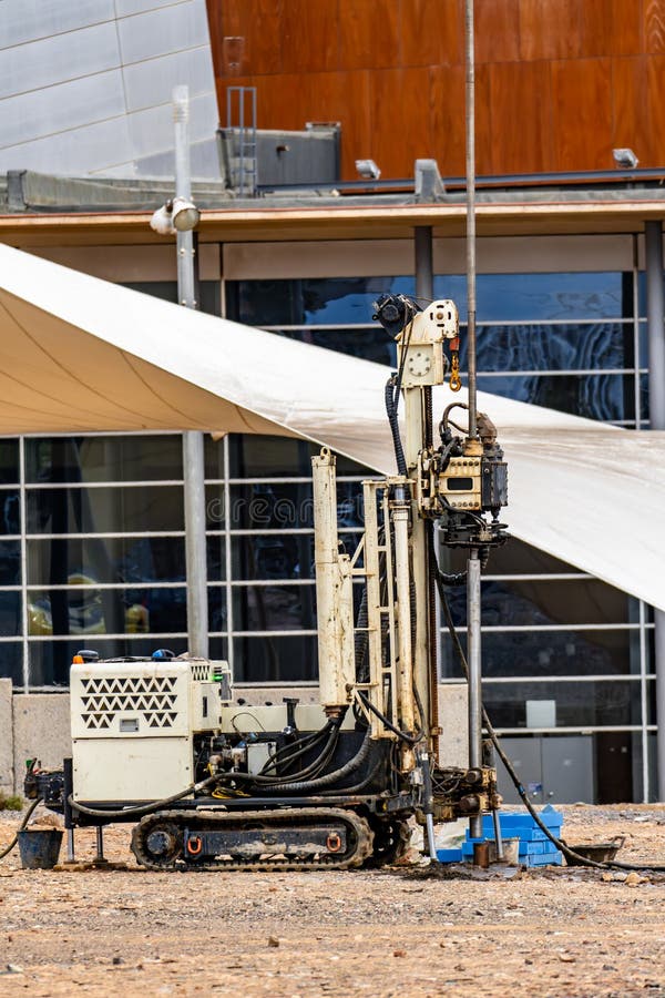 A White Machine is Digging into the Ground Editorial Image - Image of ...