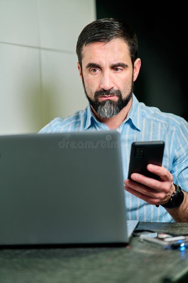White Man with Beard Looking at Laptop Screen with Head Down Stock ...