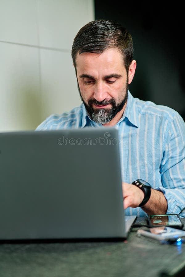 White Man with Beard in Smiling Attitude Typing on Computer Stock Photo ...
