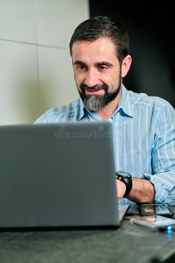 White Man with Beard Typing on Laptop and Smiling Stock Image - Image ...