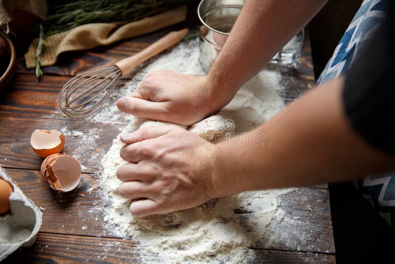 A Man Cooks Kneading Dough. Stock Photo - Image of hand, ingredients ...