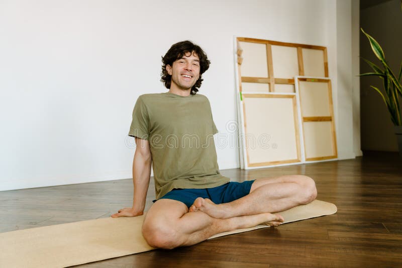 White Man Laughing and Sitting on Mat during Yoga Practice Stock Image ...