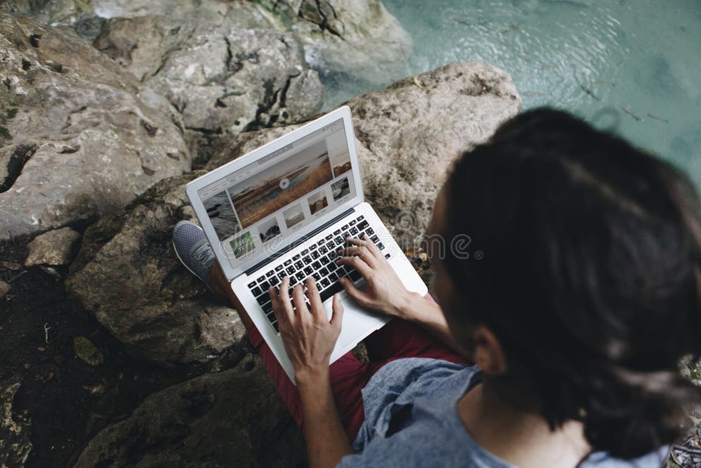 White Man Using Computer Laptop at Waterfall Stock Photo - Image of ...