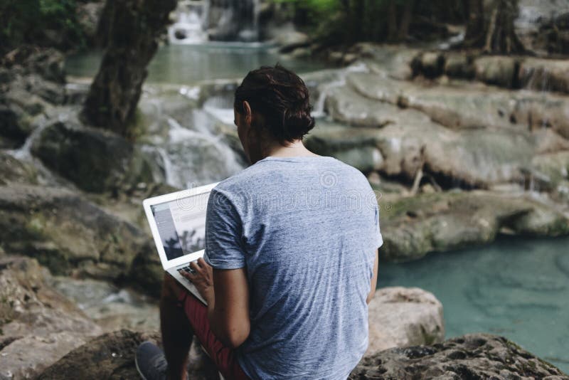 White Man Using Computer Laptop at Waterfall Stock Photo - Image of ...