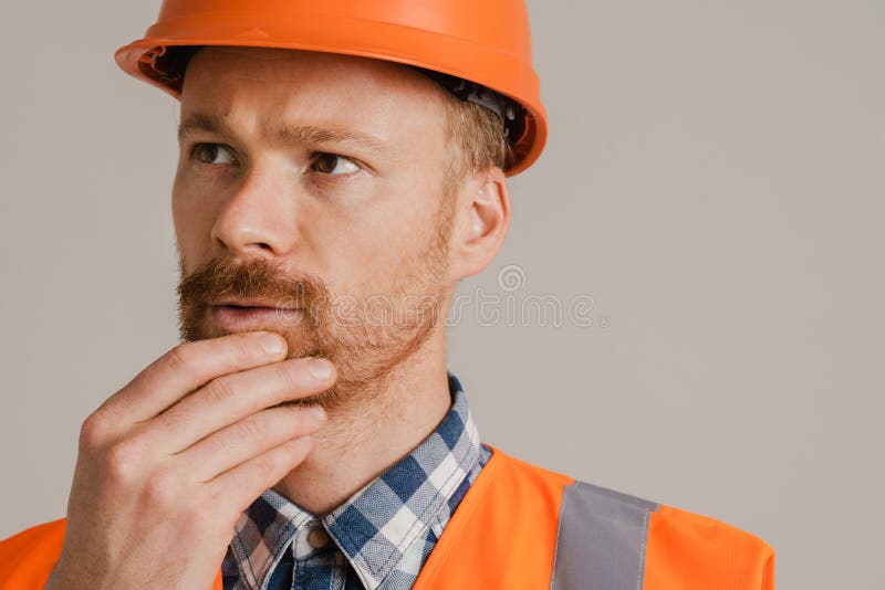 White Man Worker Wearing Helmet and Vest Looking Aside Stock Photo ...