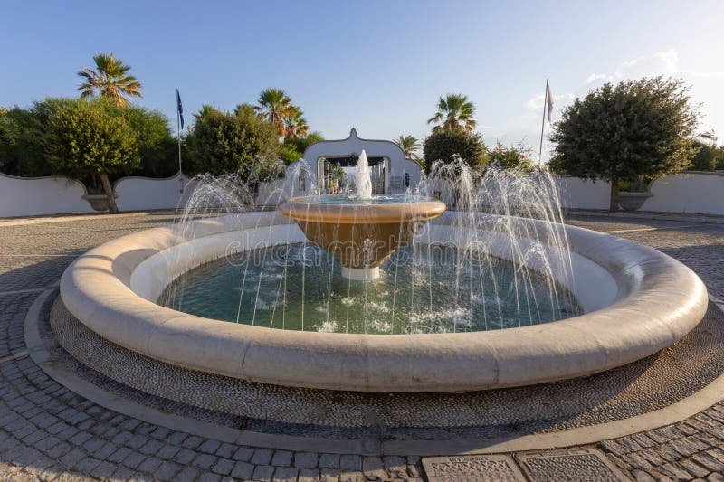 A White, Marble Fountain Standing in a Small Circular Square. Clear ...
