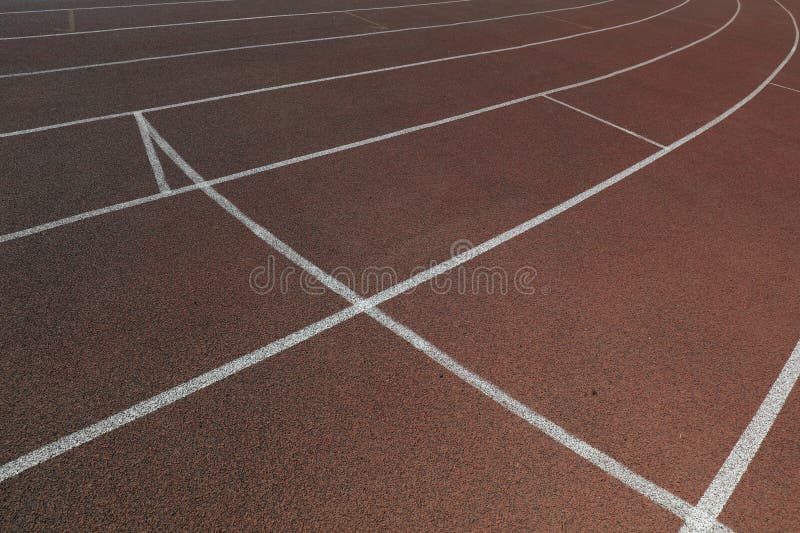 White Markings on the Red Runway Stock Photo - Image of lane, curves ...