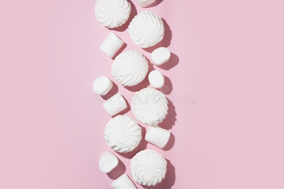 White Marshmallows and Zephyr on Light Pastel Pink Table. Banner with Empty Space for the Text ...