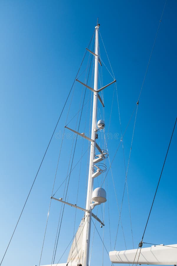 White Massive Masts on a Sailing Ship on a Solid Blue Sky Background ...