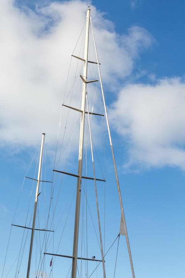 A White Mast Against a Blue Sky in City. Stock Photo - Image of metal ...