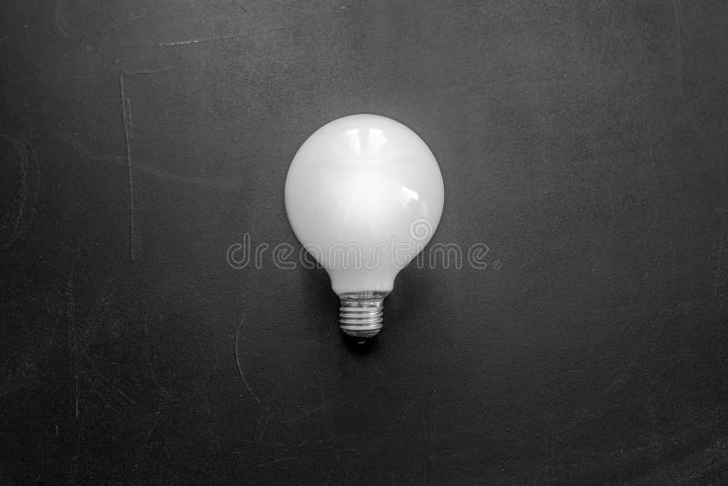 White Matte Light Bulb on the Black Wall Stock Image - Image of ...